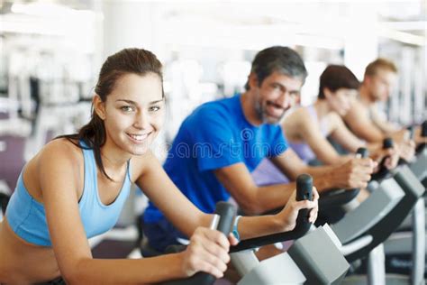 Feeling Good During The Warm Down A Row Of People Working Out On The