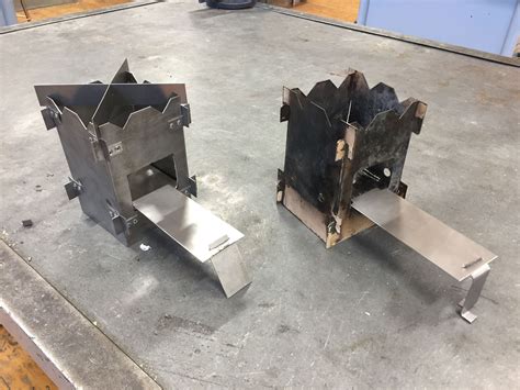two collapsable portable sheet metal rocket stoves the one on the