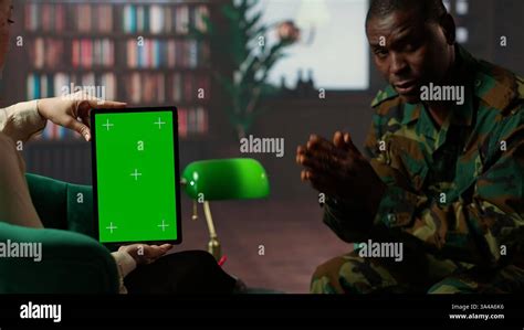 Black Army Soldier Crying At Therapy Session Next To Chroma Key Screen Seeking Professional