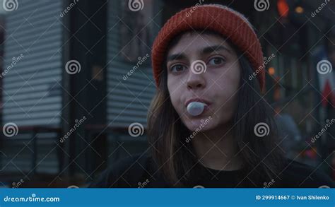 Portrait Of A Hipster Girl In The City On The Street Blowing Bubble
