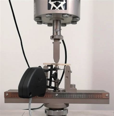 Detail Of A Sample In The Supports Of The Instron Machine Beneath Of Download Scientific