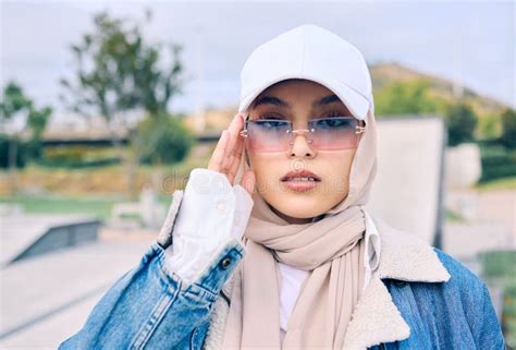 Portrait Fashion Or Sunglasses With An Islamic Woman Outdoor In A Cap