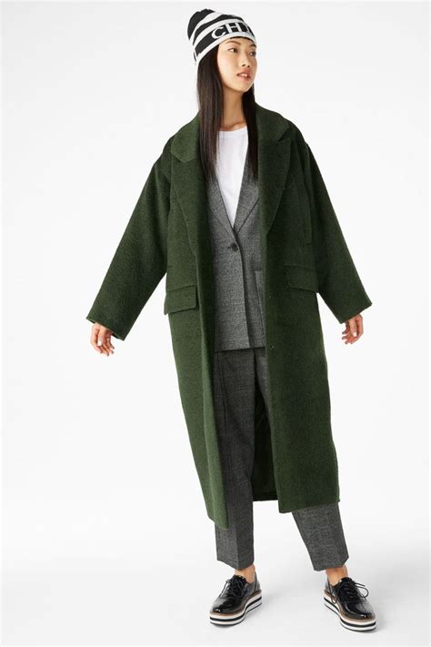 This wool-blend coat is single-breasted with double the pockets for ...