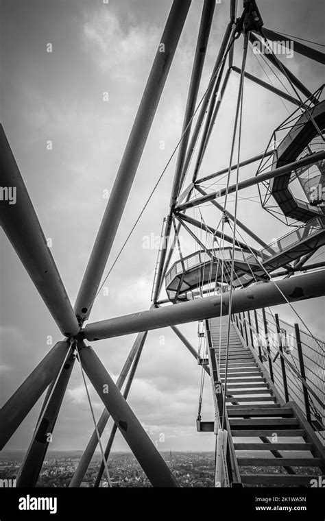 A Vertical Black And White Shot Of A Viewing Platform In A Cloudy