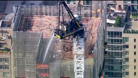Pedestrians Scatter As Fire Causes Nyc Construction Cranes Arm To