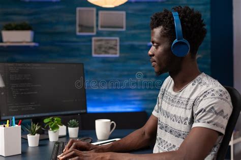 It Businessman Wearing Headphones Programming Codes For Firewall Server