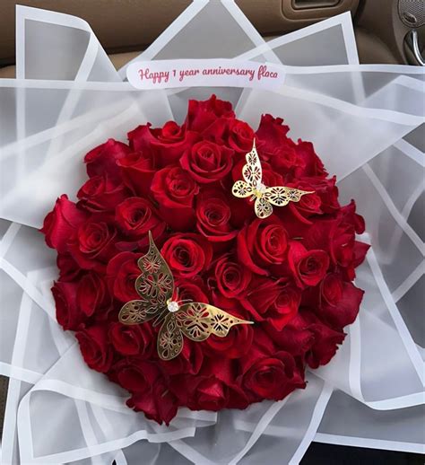 Uganda Anniversary Flower Bouquet With Red Roses And Gold Butterflies