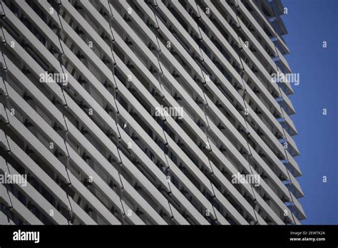 Commercial High Rise Building Facade Covered With Symmetrical White Cladding Panels In San Diego Commercial High Rise Building Facade Covered With Symmetrical White Cladding Panels In San Diego