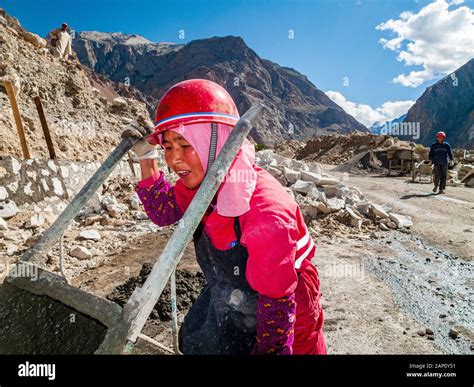 Road Construction At Karakorum Highway By Chinese Workers A Woman Is