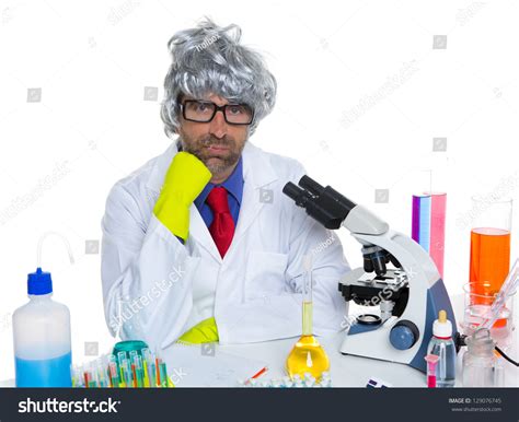 Crazy Pensive Nerd Scientist At Chemical Laboratory Thinking With