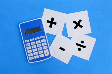 Premium Photo Calculator And White Paper With Plus Minus Multiply