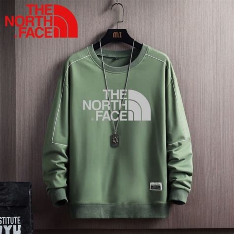 ☄ The North Face เสื้อกันหนาวผู้ชายหลวมสบายๆเสื้อยืดแขนยาวเกาหลีผ้าฝ้ายเรียบง่าย Th