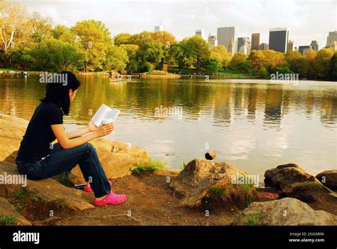 A Young Woman Finds A Quiet Place In The Middle Of New York City Stock
