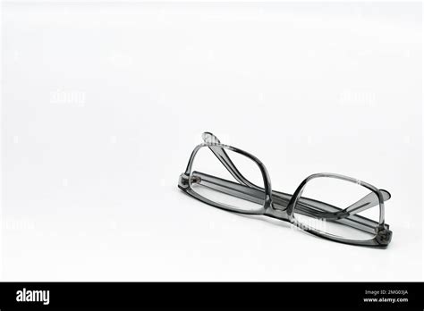 Pair Of Glasses With Grey Frames On A Plain White Background Copy