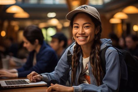 Premium AI Image Classmates In Action Female Babe Using Laptop In Babe Or College