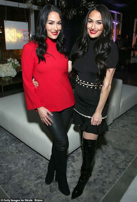 Nikki Bella Turns Heads In Thigh High Boots As She And Sister Brie