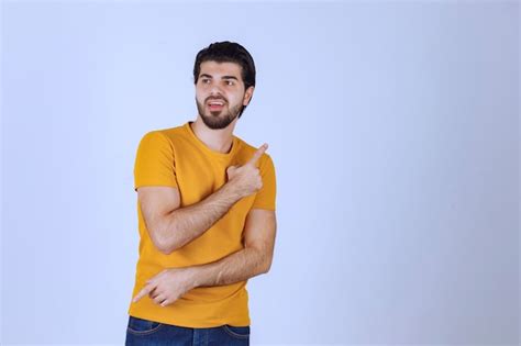 Free Photo Man Pointing Something In The Behind
