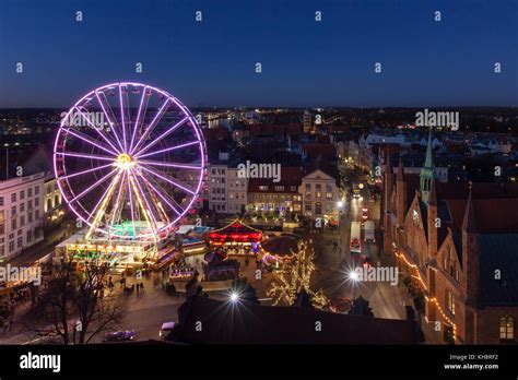 Illuminated Ferris Wheel At Evening Christmas Market In Winter At