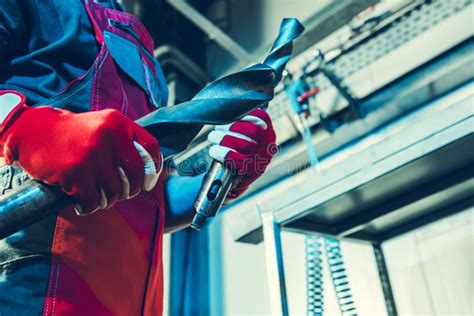 Industrial Worker With Lathe Drill Bits In His Hands Stock Image