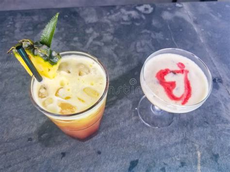 Sex On The Beach Drink With Heart Shape And Another Drink At Poolside