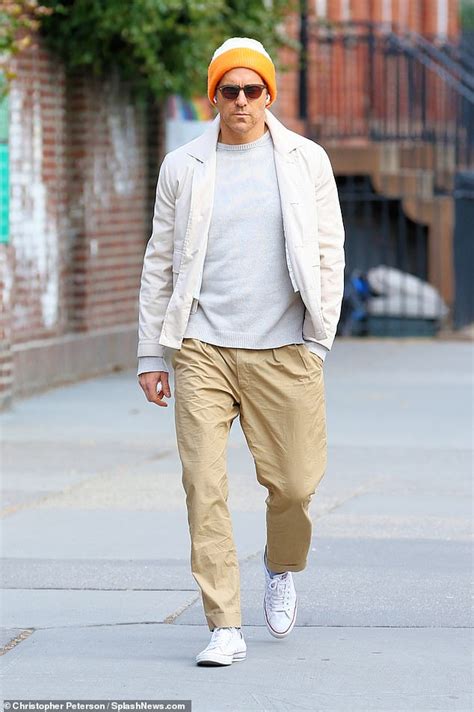 Ryan Reynolds Looks Lost In Thought With Earbuds In As He Strolls The