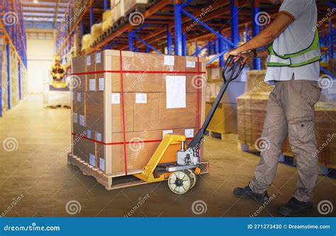 Workers Unloading Package Boxes On Pallets In Storage Warehouse Forklift Pallet Jack Loader