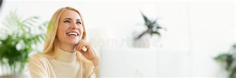 Happy Mature Woman Dreaming When Websurfing On Laptop Stock Image