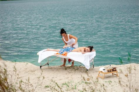 Premium Photo An Attractive Caucasian Woman Lying Down On A Massage