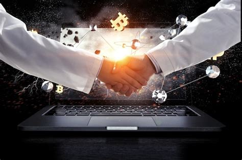 premium photo business handshake by a man and a woman laptop and