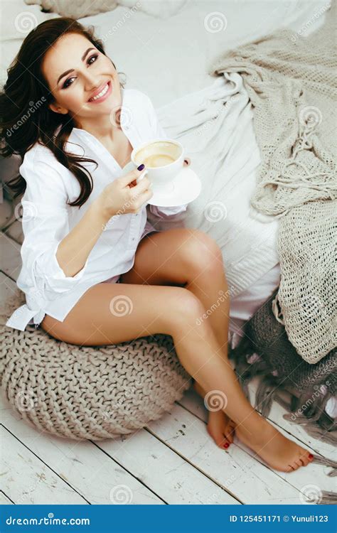 Young Pretty Brunette Woman In Her Bedroom Sitting At Window Ha Stock