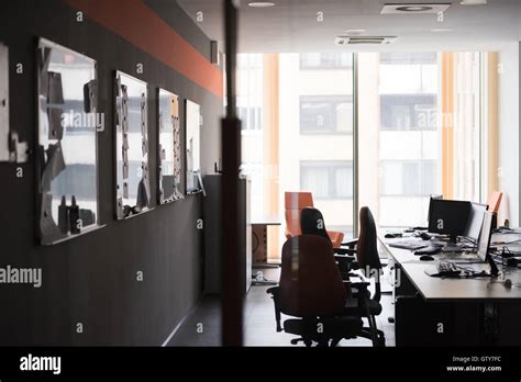 Empty Startup Office Interior With Modern Computers And Dual Screen