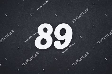 White Number 89 On Plywood With Black Paint As Background A Black