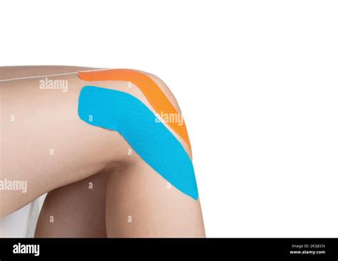 Female Knee Joint With Orange And Blue Tape For Microcirculation And