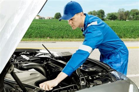 Premium Photo Man Repairing Car Engine On Road
