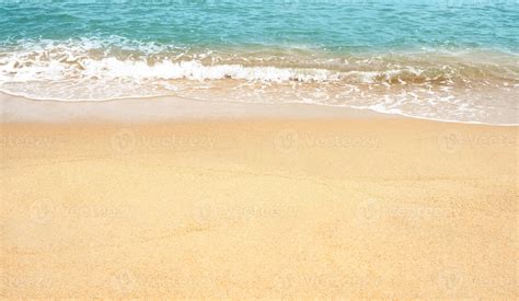 Sand Beach And Blue Ocean With Soft Wave Form On Sand Texture Seaside View Of Brown Beach Sand