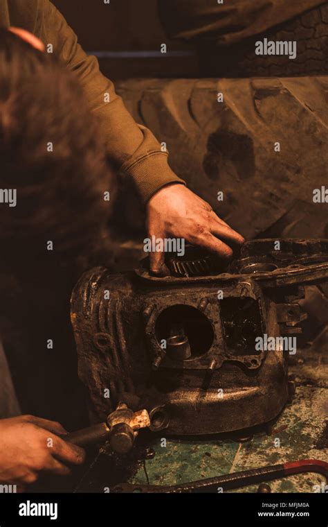 Motorcycle Engine Disassembly Man Knocks Rusty Detail With A Hammer