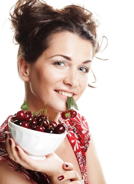 Premium Photo Woman With Cherries Over White