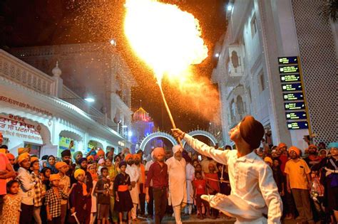 Sikh Devotees Take Part In A Nagar Kirtan Procession On The Eve Of Guru