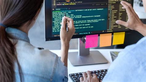 Pensive Programmer Working On On Desktop Pc Programming Code
