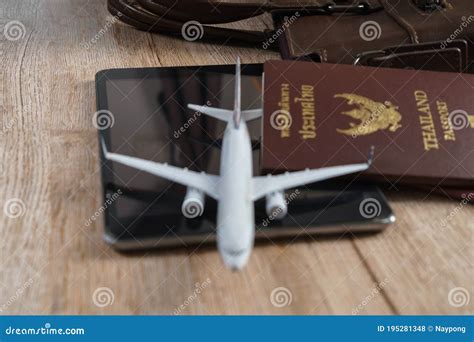 Small Plane Model Thai Passport Leather Bag Tablet On Wooden Board