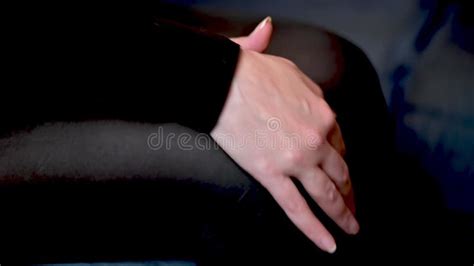 The Woman Rubs Her Back A Woman Is Sitting On The Couch With Back Pain