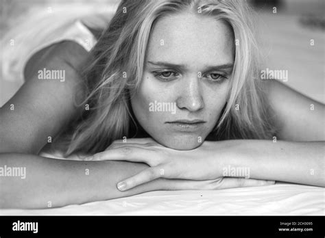 Depression And Loneliness Sad Thinking Young Woman Lying Alone In Bed