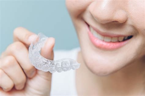 Premium Photo Close Up Of Woman Holding Plastic Braces
