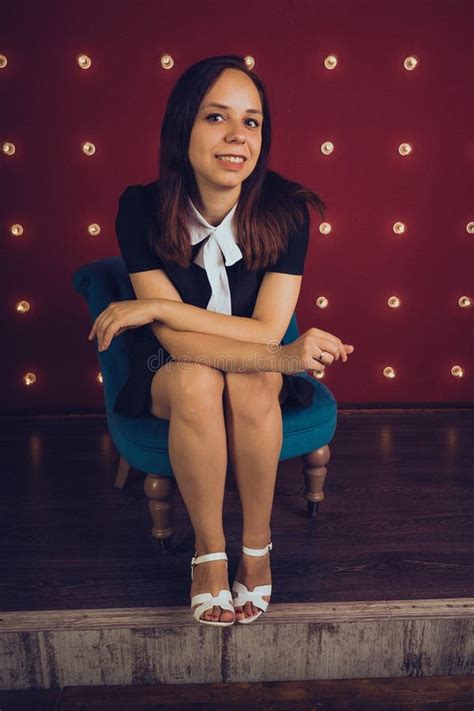 The Girl Sits On A Chair And Looks Haughty Look Stock Image Image Of