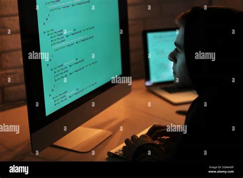 Hacker With Computer And Laptop Stock Photo Alamy