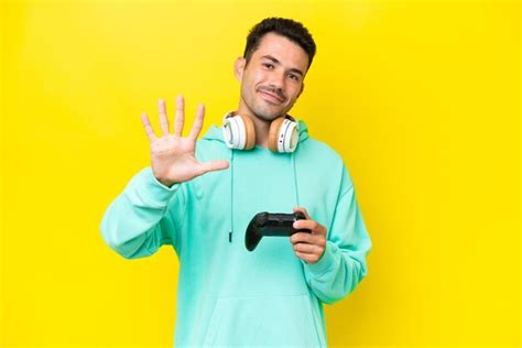 Premium Photo Young Handsome Man Playing With A Video Game Controller