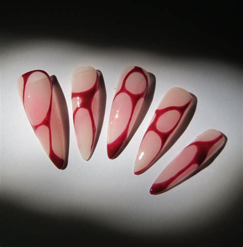 dark red blushing nails red abstract lines nail y2k style nails
