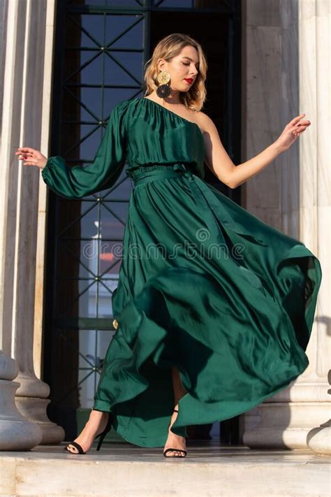 Stunning Beautiful Young Model Posing Outside While Wearing Long Green