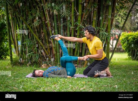 Thai Massage Therapy Session Outdoors With Bamboo Background Man And