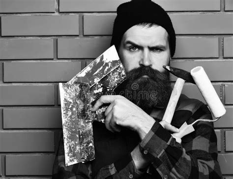 Bearded Foreman Holding Various Building Tools with Serious Face Stock ...
